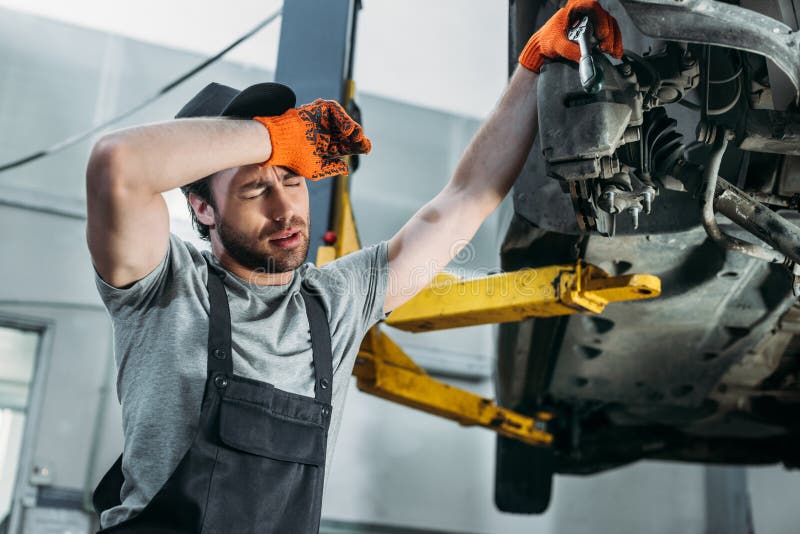 Tired Mechanic Suffering from Neck Pain in Close-up Stock Image - Image ...