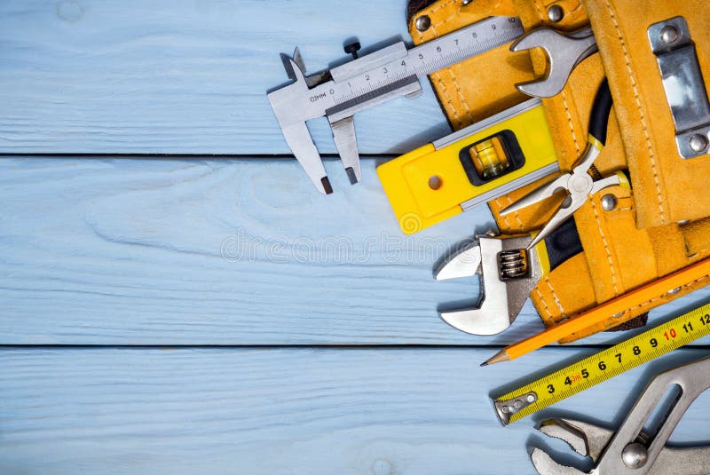 Professional Tool Kit for Builder in a Bag on Blue Wooden Boards Also ...