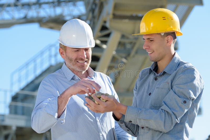 Professional Two Engineers Discussing New Project Outdoors Stock Image ...