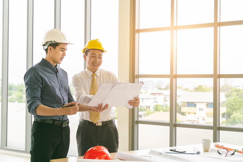 Professional Two Engineers are Discussing the New Project. the Senior ...