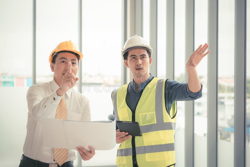 Professional Two Engineers are Discussing the New Project. the Senior ...