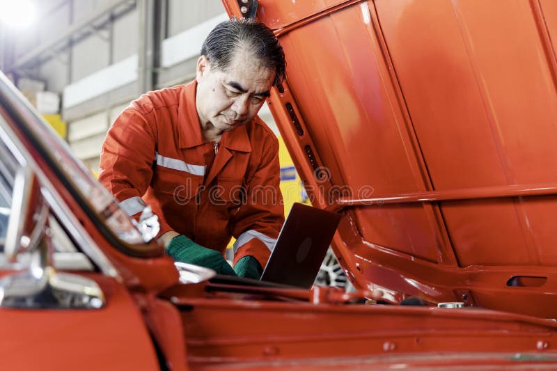 Professional Uniformed Car Mechanic Working in Service Station Stock ...