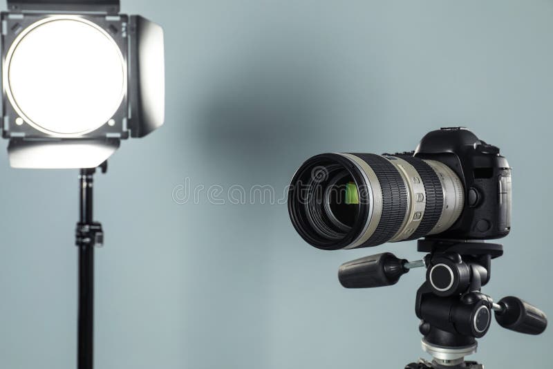 Professional Video Camera and Lighting Equipment on Grey Background ...