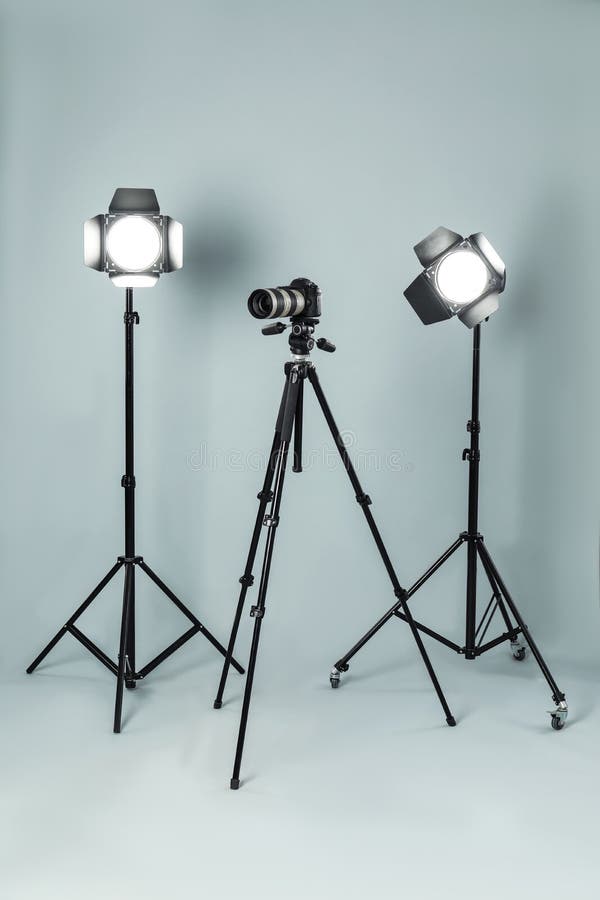 Professional Video Camera and Lighting Equipment on Grey Background ...