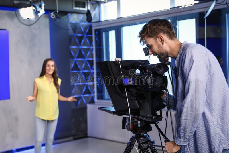 TV Camera and Presenter Host on a Live News Broadcast on Location Stock ...