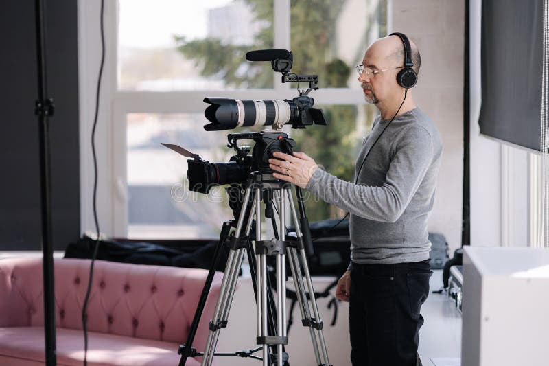 Professional Video Operator Records the Interview. Cameraman Shoots ...