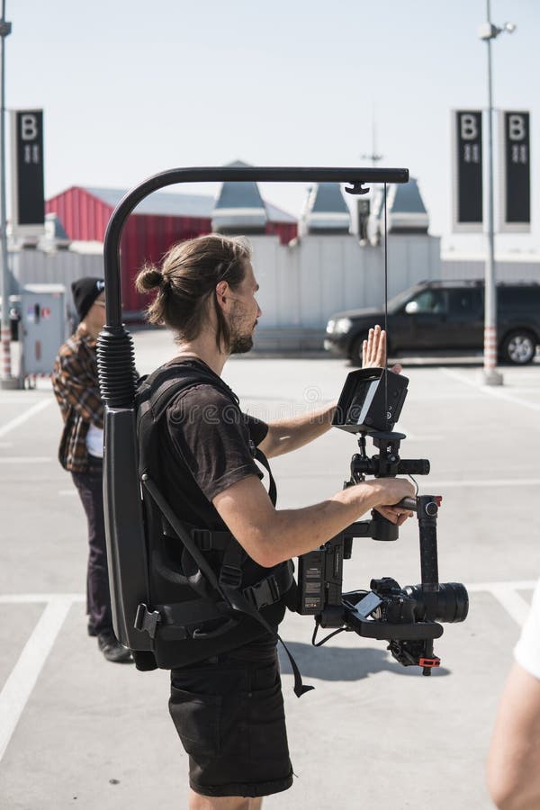 Professional Videographer Holding Camera on 3-axis Gimbal Which Mounted ...