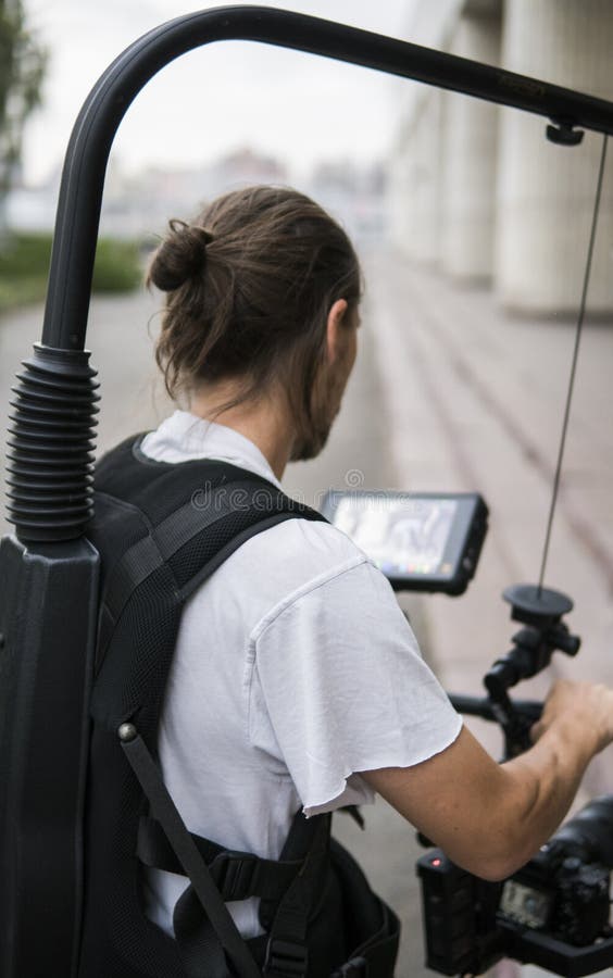 Professional Videographer Holding Camera on 3-axis Gimbal Which Mounted ...