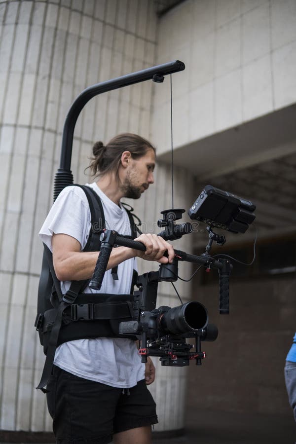 Professional Videographer Holding Camera on 3-axis Gimbal Which Mounted ...