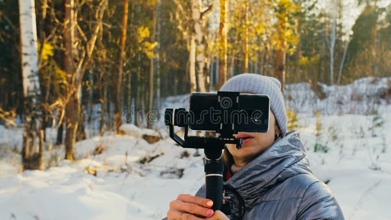 Professional Videographer Holding DSLR Camera on 3-axis Gimbal ...