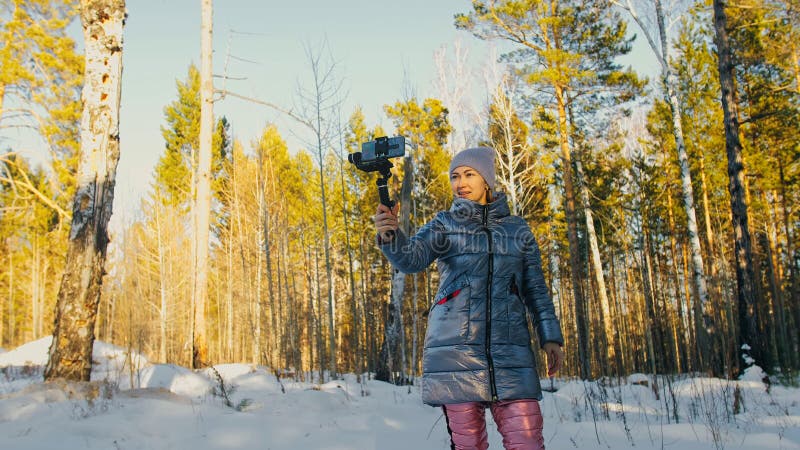 Professional Videographer Holding DSLR Camera on 3-axis Gimbal ...