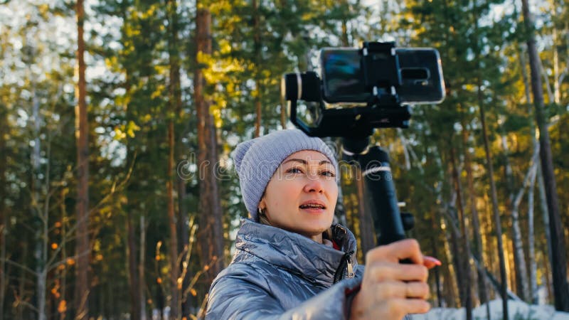 Professional Videographer Holding DSLR Camera on 3-axis Gimbal ...