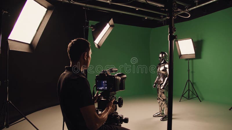 Videographer Filming Futuristic Robot in Green Screen Studio Stock ...