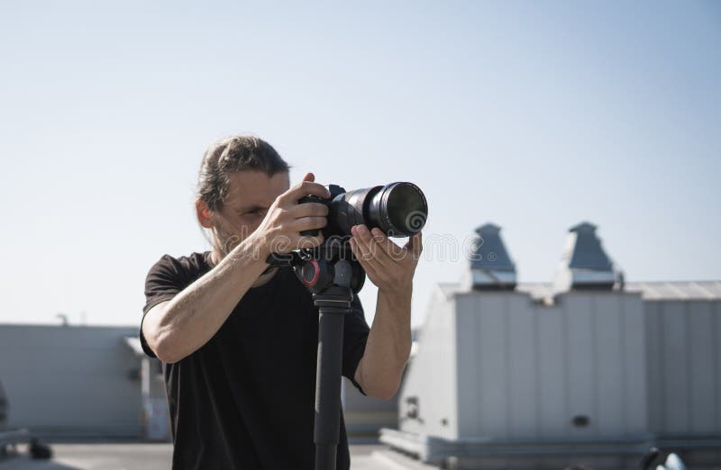 Professional Videographer Using Cinema Digital Video Camera. Stock ...