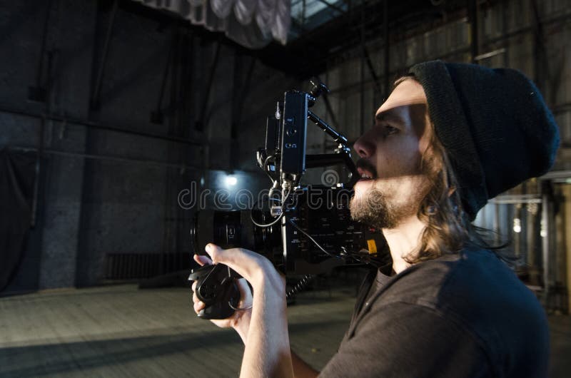 Professional Videographer Using Cinema Digital Video Camera for Filming ...