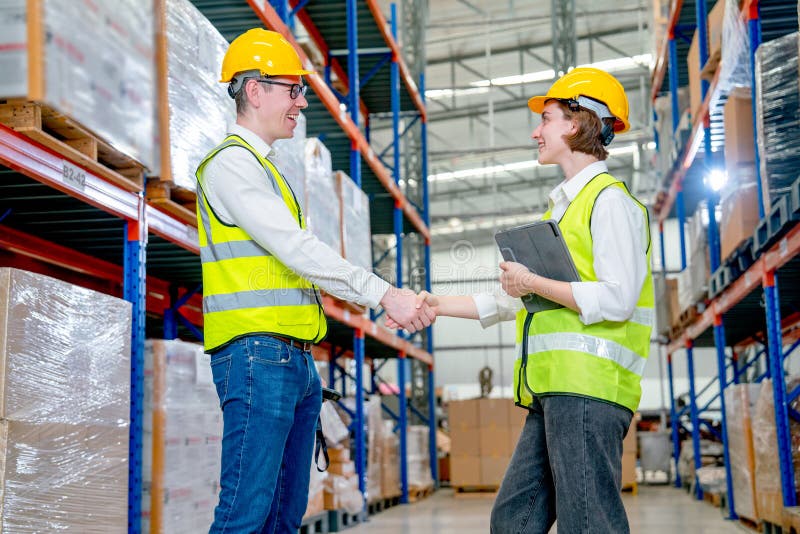 Professional Warehouse Worker Man and Woman Shake Hands Together before ...