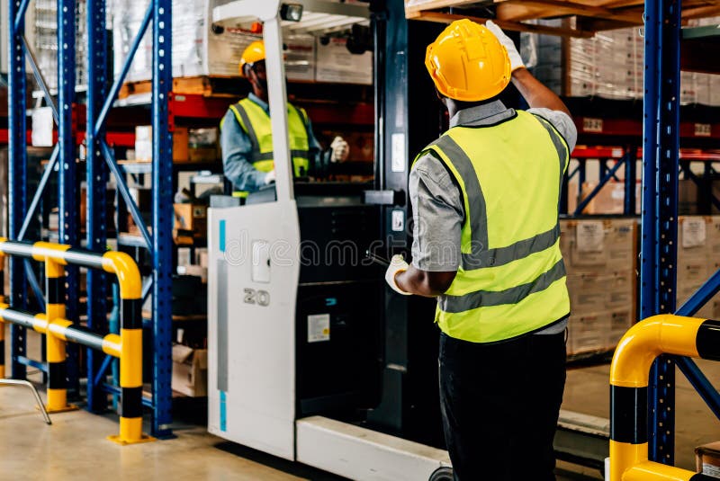 Professional Warehouse Worker Moving Cardboard Boxes by Forklift ...