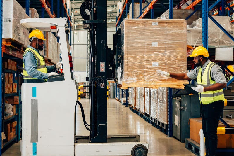 Professional Warehouse Worker Moving Cardboard Boxes by Forklift ...