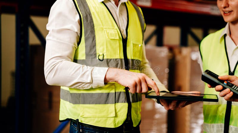 Professional Warehouse Workers with Safety Vest Talking and Discussing ...