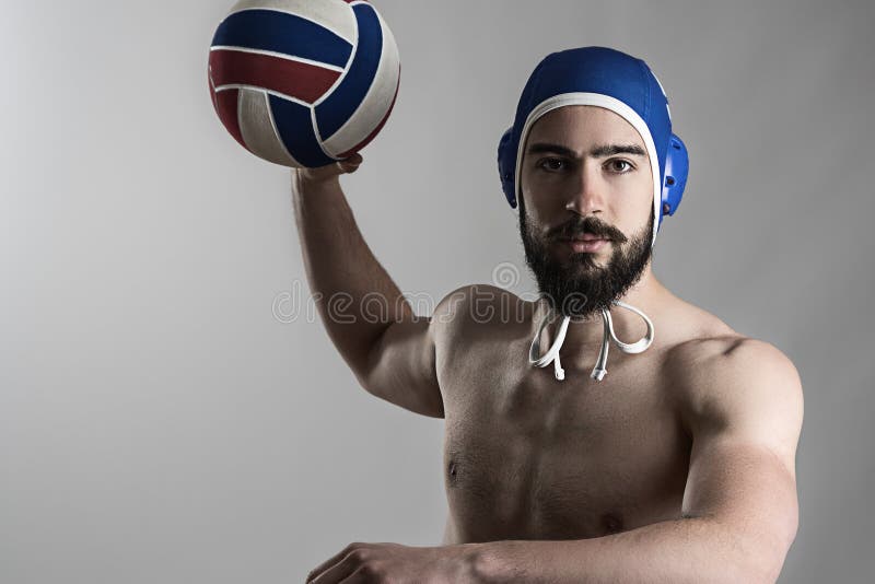 Professional Water Polo Player Shooting Ball Looking at Camera Stock ...