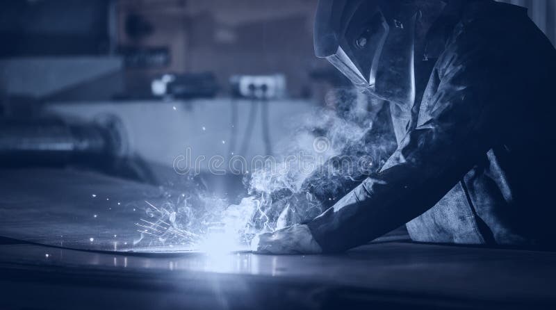 Professional Welder Performs Welding Work on Metal in Protective Mask ...