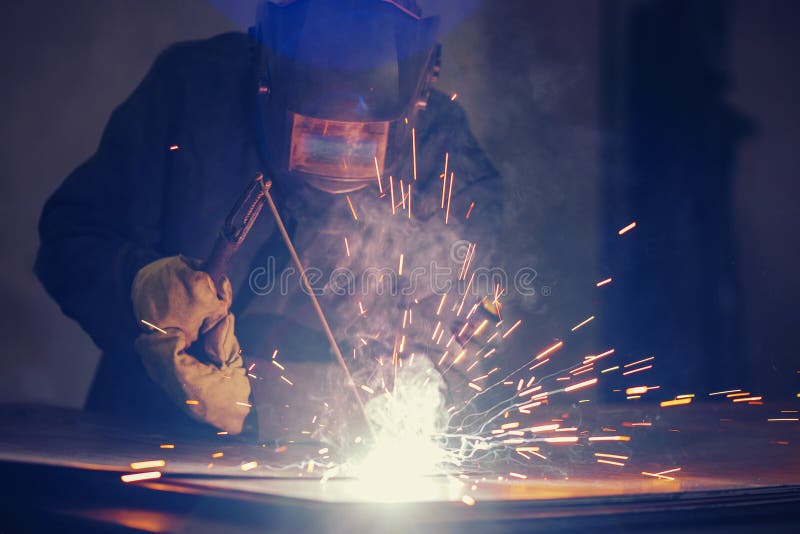 Professional Welder Performs Welding Work on Metal in Protective Mask ...