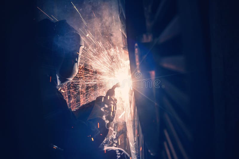 Professional Welder Performs Welding Work on Metal in Protective Mask ...