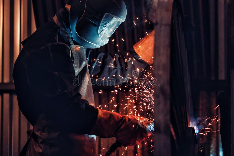 Professional Welder Performs Welding Work on Metal in Protective Mask ...