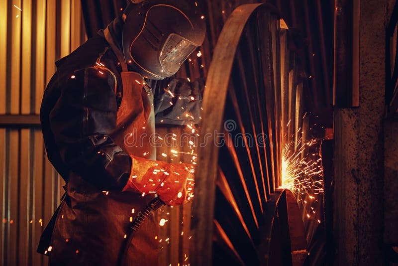 Professional Welder Performs Welding Work on Metal in Protective Mask ...