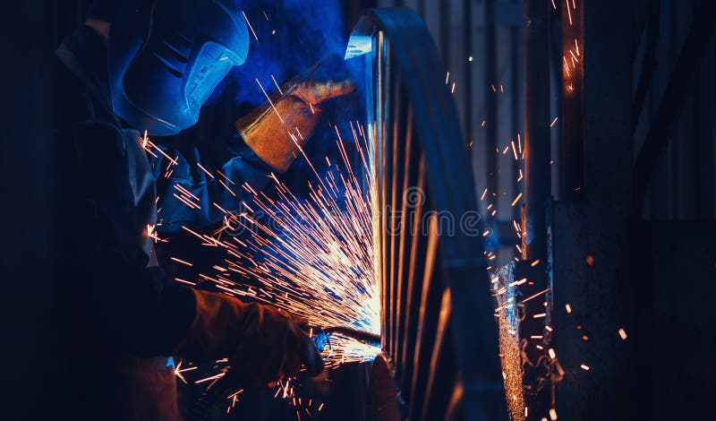 Professional Welder Performs Welding Work on Metal in Protective Mask ...