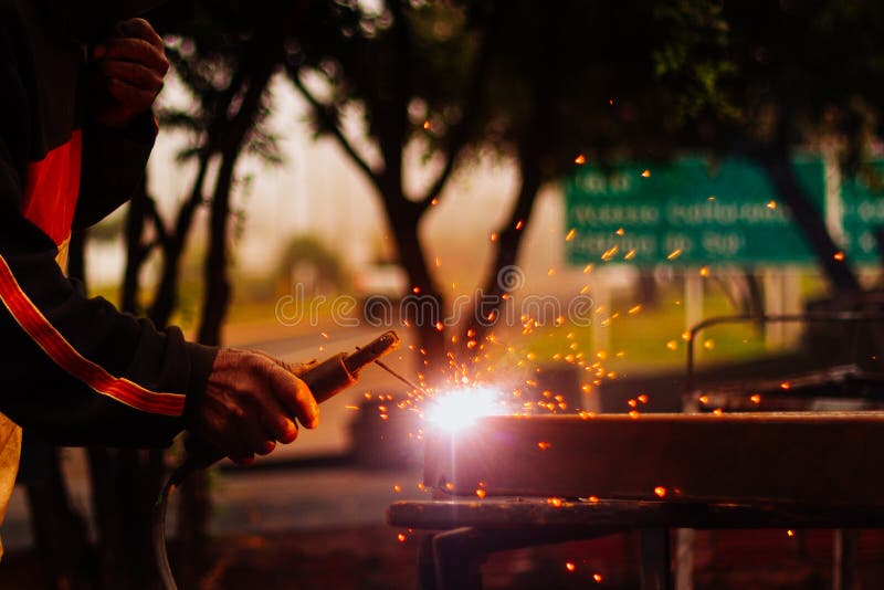 Professional Welder Using Welding Machine. Working On Metal Pipe Stock ...