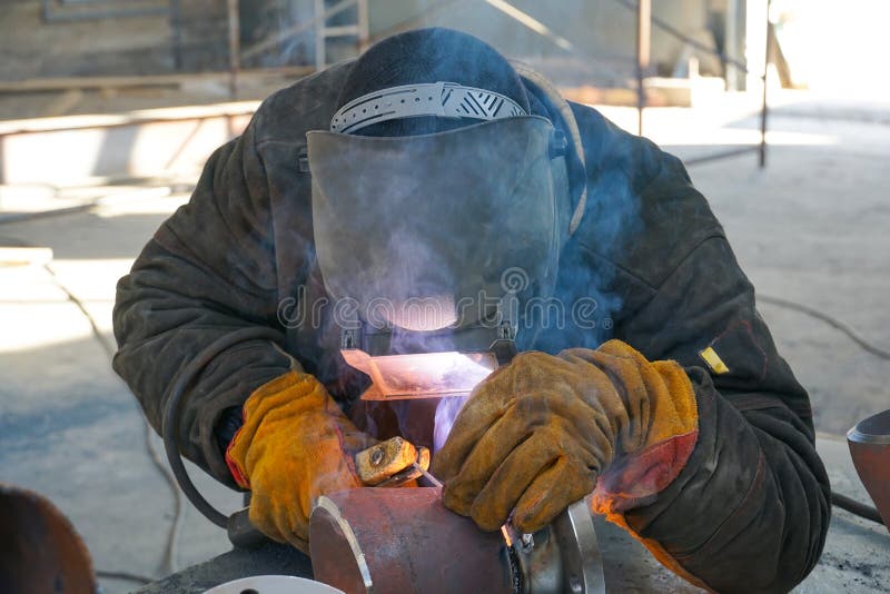 Professional Welder Works with Manual-arc Welding. Stock Image - Image ...