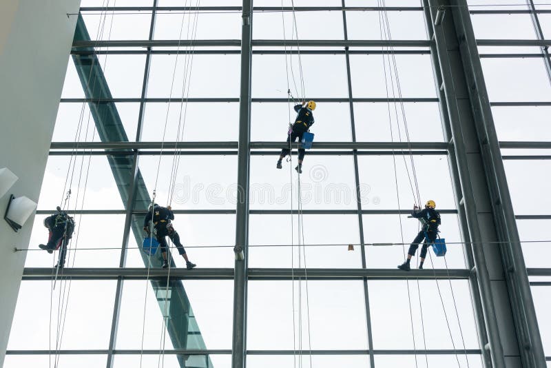 Professional Window Cleaners Climbing Up Facade Stock Photo - Image of ...