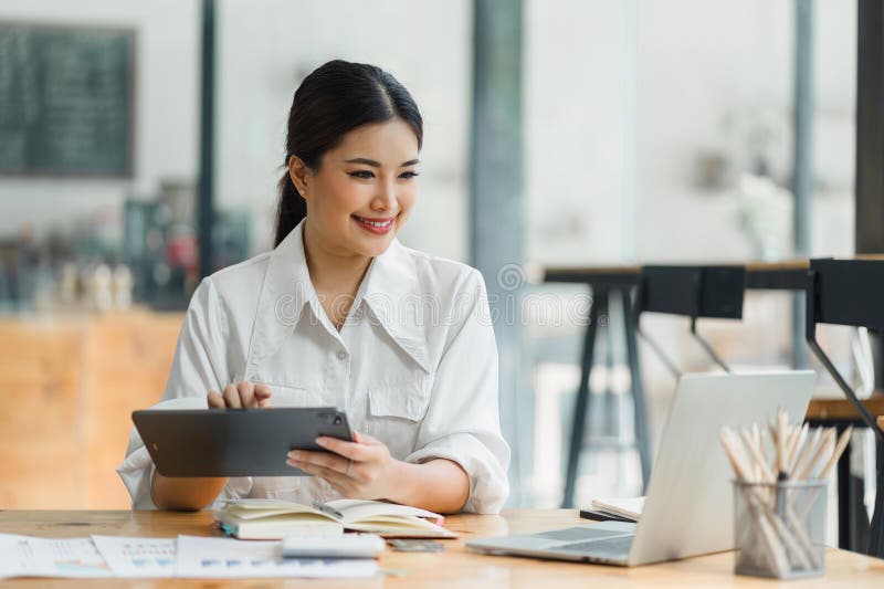 Professional Woman Analyzing Data on Tablet at Desk. Stock Photo ...