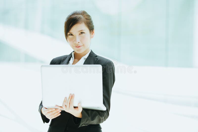 Professional Woman with Laptop Stock Photo - Image of asian, staring ...