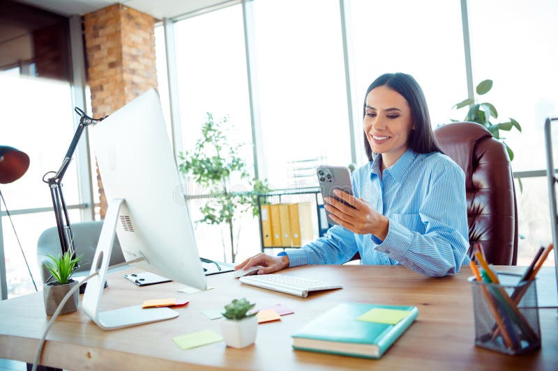 Professional Woman Using Smartphone at Work, Sitting at Desk in Modern ...