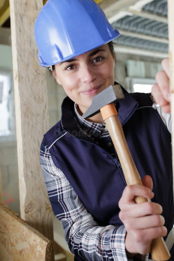 Professional Woman Using Hammer and Nail Stock Photo - Image of grin ...