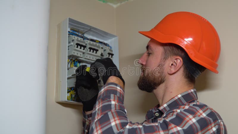 Professional Electrician Worker in a Hard Hat and Plaid Shirt ...