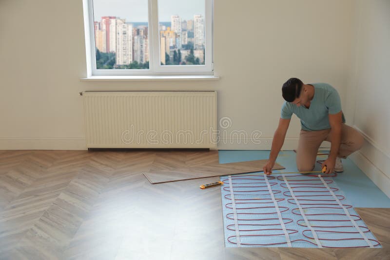 Professional Worker Installing Electric Underfloor Heating System ...