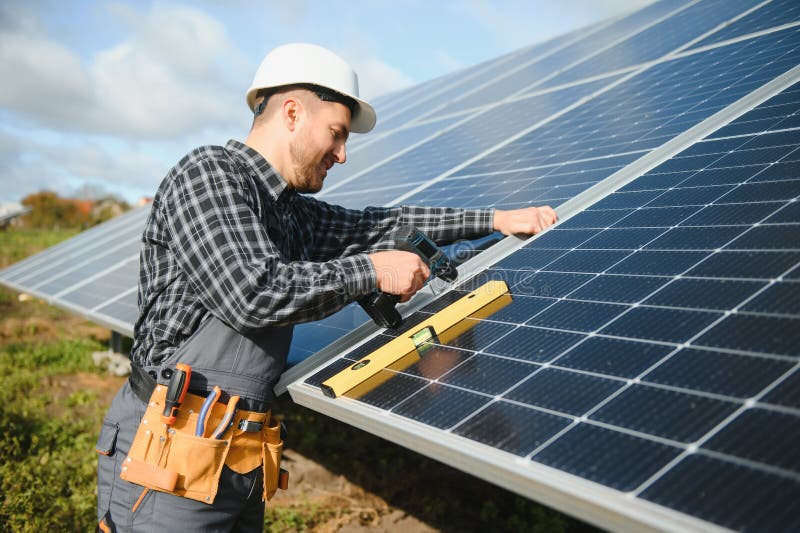 Professional Worker Installing Solar Panels on the Metal Construction ...