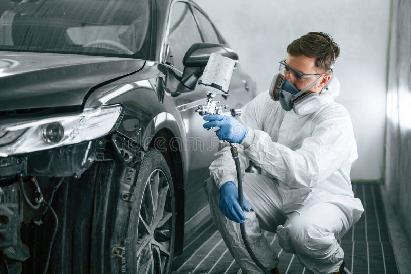 Professional Worker. Man is Painting a Car by Using Spray Guy Stock ...