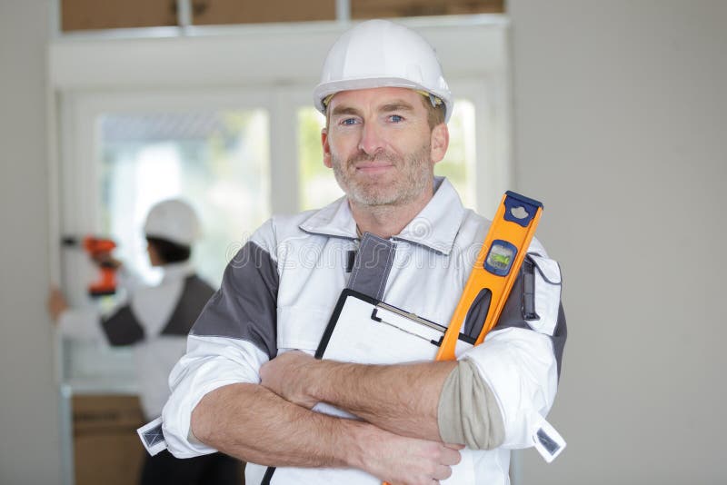 Professional Worker Posing with Spirit Level at Construction Site Stock ...