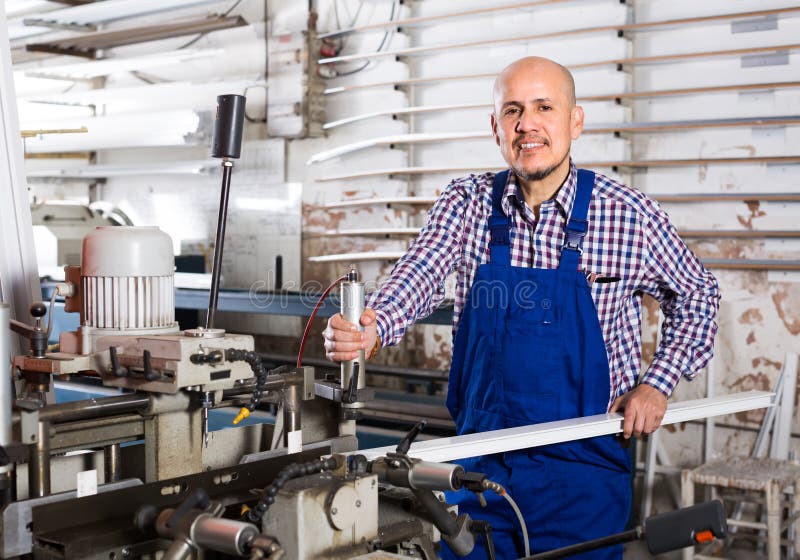 Professional Worker in PVC Shop Stock Photo - Image of machine ...