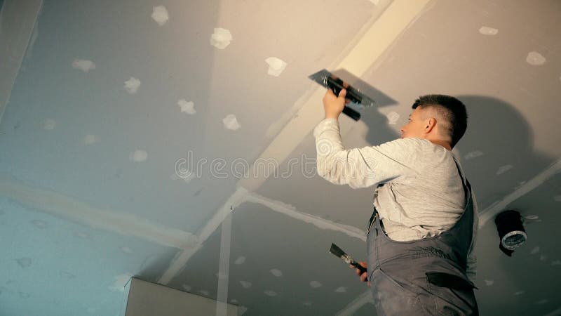 Handyman Man Spackling Gypsum Plasterboard Ceiling with Putty Stock ...