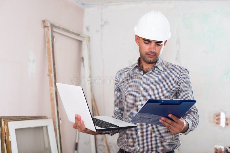 Professional Worker is Standing with Laptop and Folder with Docu Stock ...