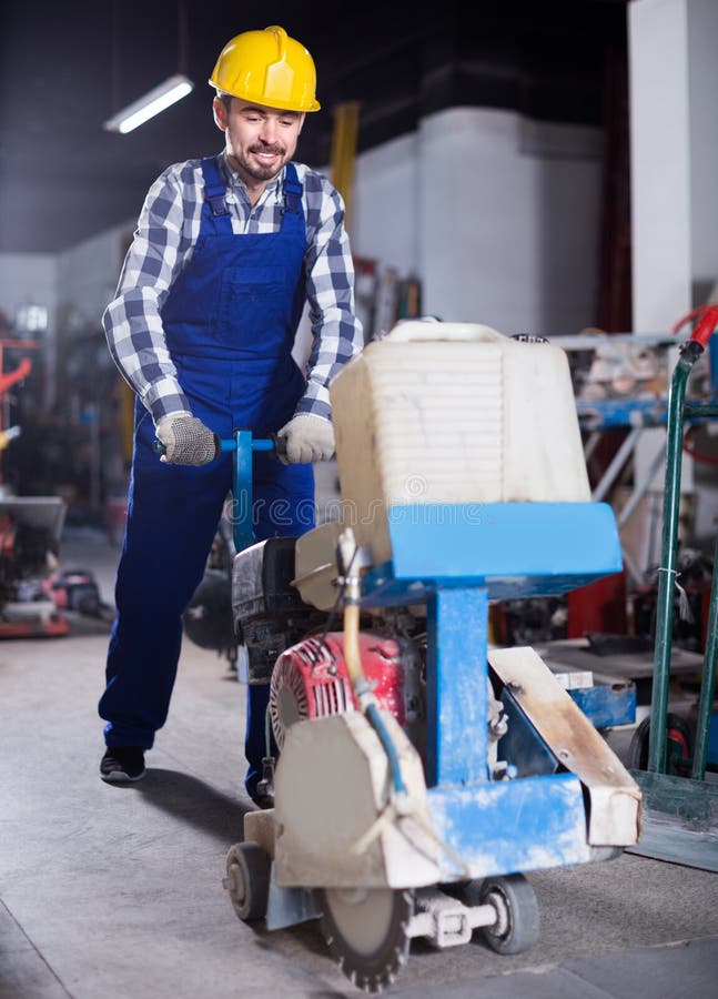 Professional Worker is Using Gas Saw for Construction Work Stock Photo ...
