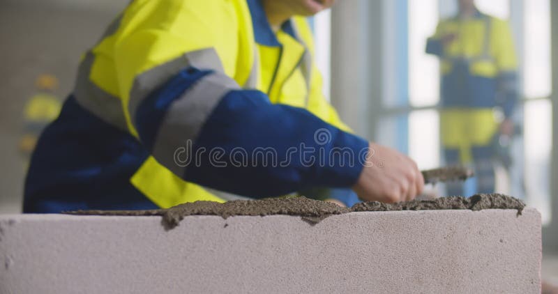 Professional Worker Using Pan Knife for Building Brick Walls with ...