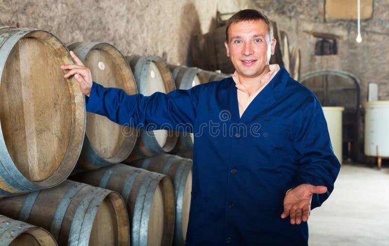 Professional Worker Posing with Wine Barrels Stock Image - Image of ...