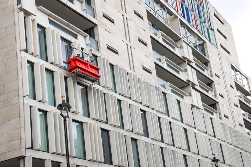 Professional Workers Use a Suspended Cradle or Steeplejack To Access ...