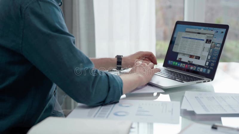 Professional Working at Laptop with Data Analysis Charts. Businessman ...